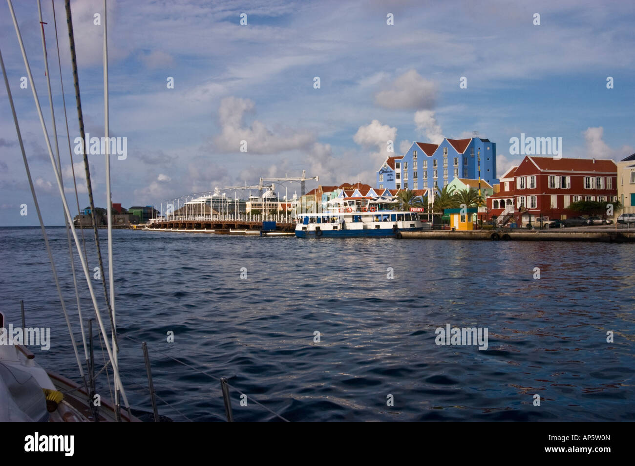 The waterfront at Punda with the local ferry at the dock Stock Photo ...
