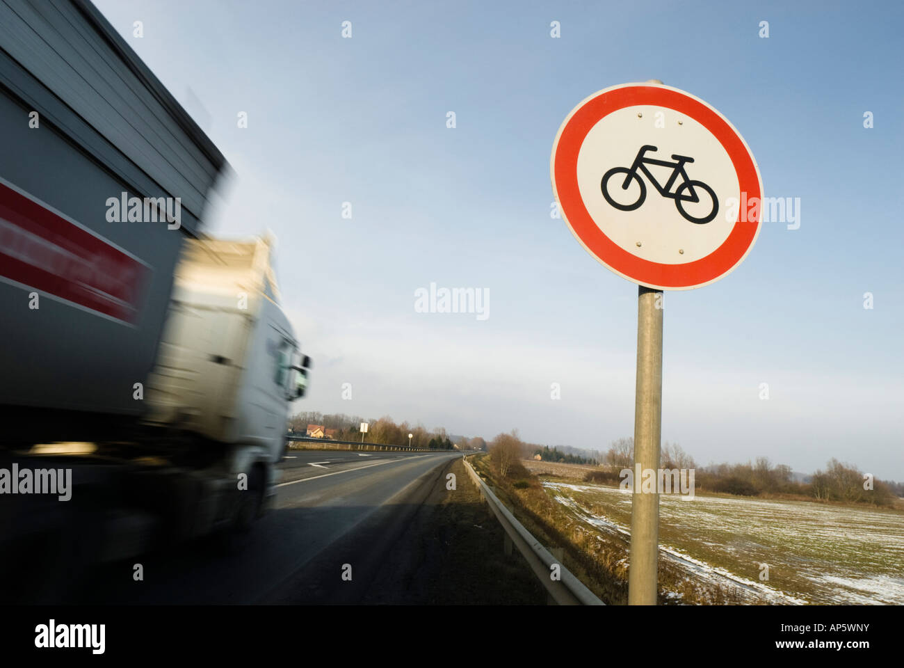 Lorry drives past a no cycling sign on a main road in Hungary Stock ...