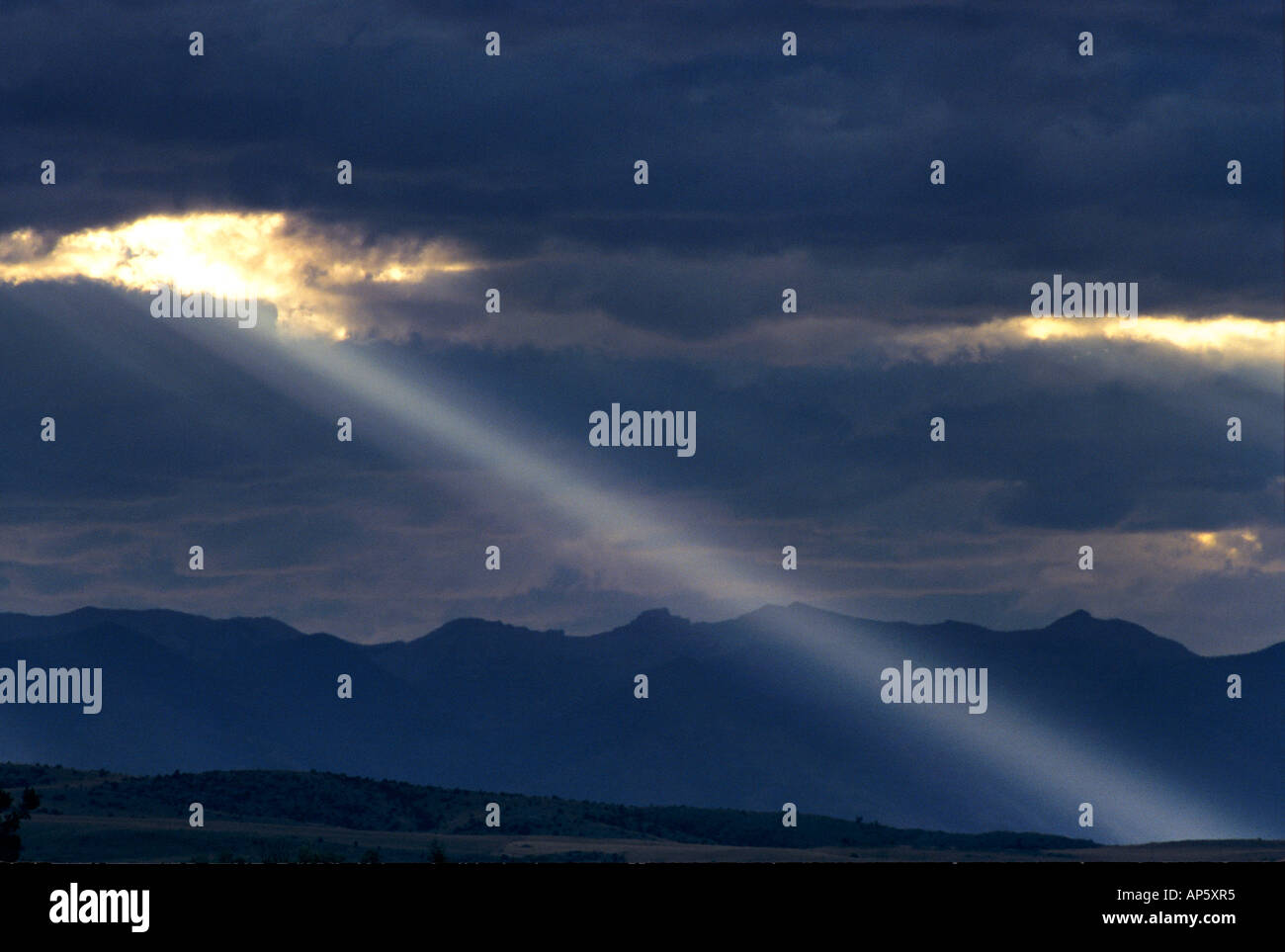 Light shaft emits from clouds near Belgrade Montana Stock Photo - Alamy