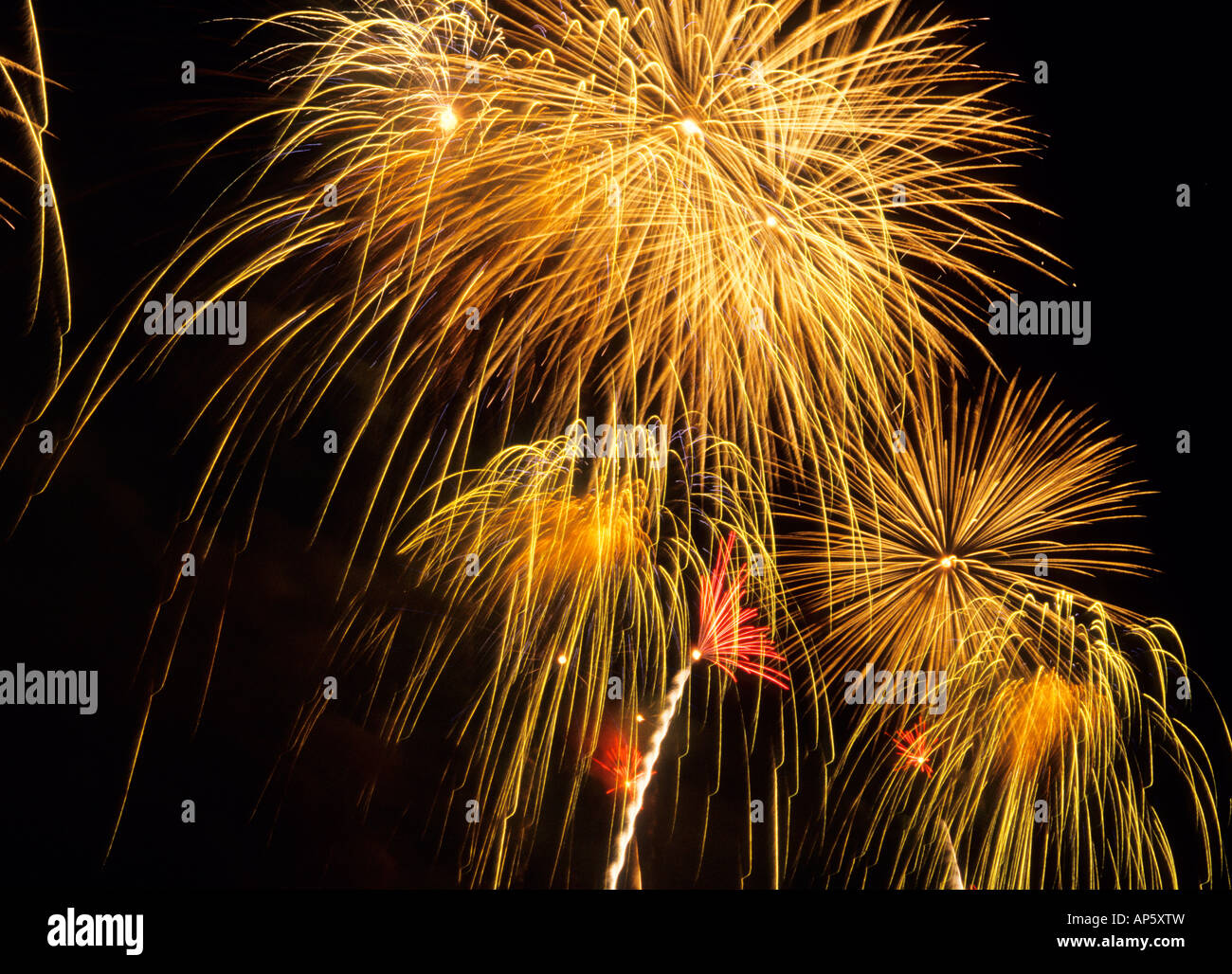 Fireworks display in the night sky celebrating July 4th with glowing ...