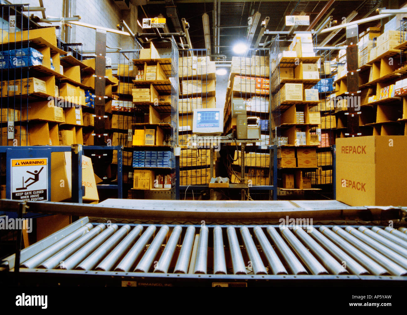 Warehouse interior. Inventory stockpile and conveyor belt. Cartons ...