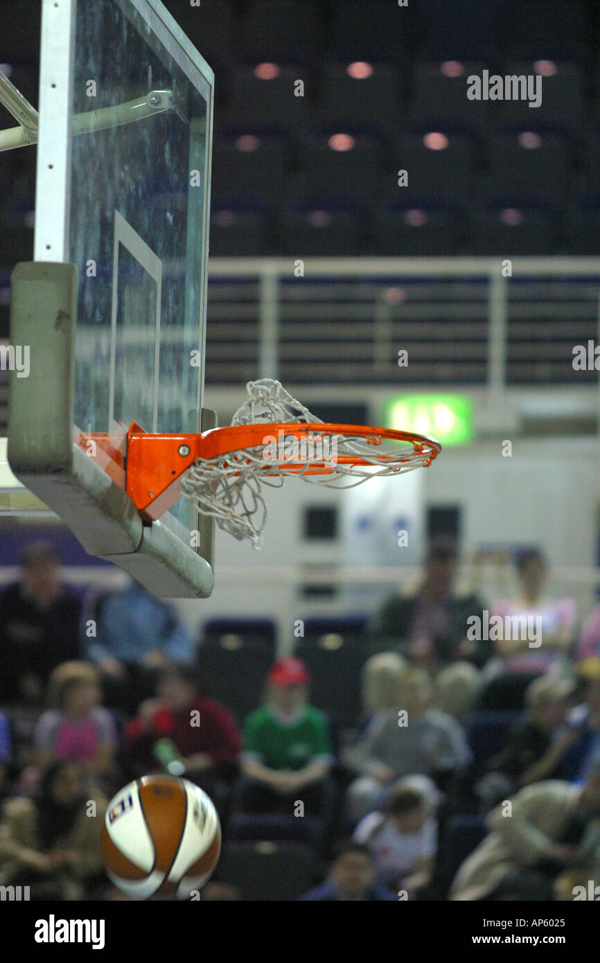 Basketball scoring in hoop Stock Photo - Alamy