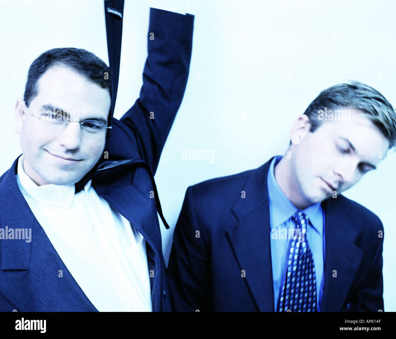 Two business men in suits one trying to hang himself Stock Photo - Alamy