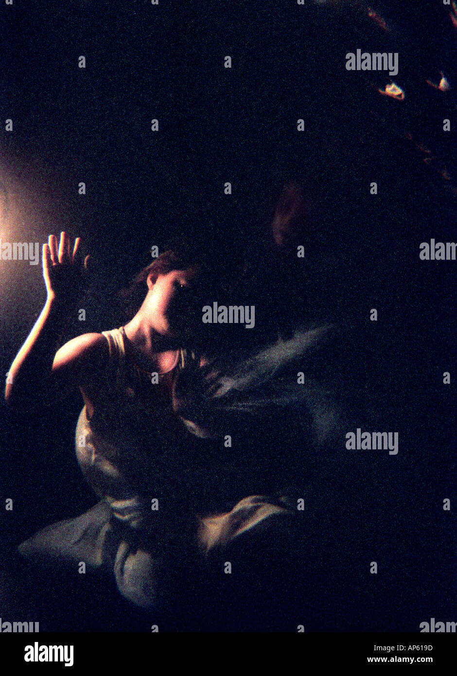 girl floating underwater at night with womans face in shadows Stock ...