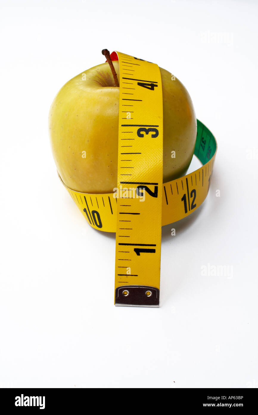Yellow Apple with tape measure Stock Photo - Alamy