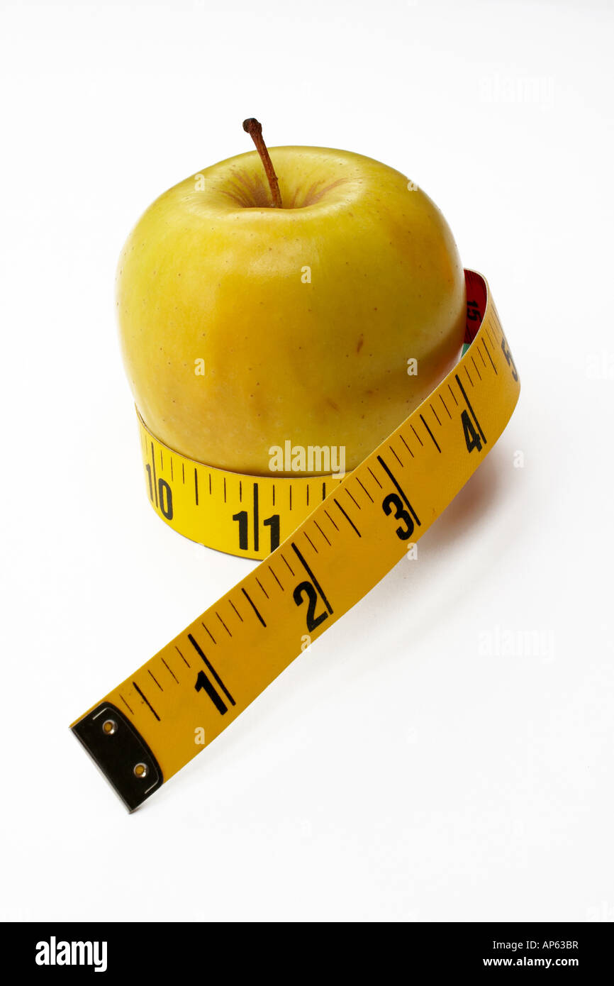 Yellow Apple with tape measure Stock Photo - Alamy