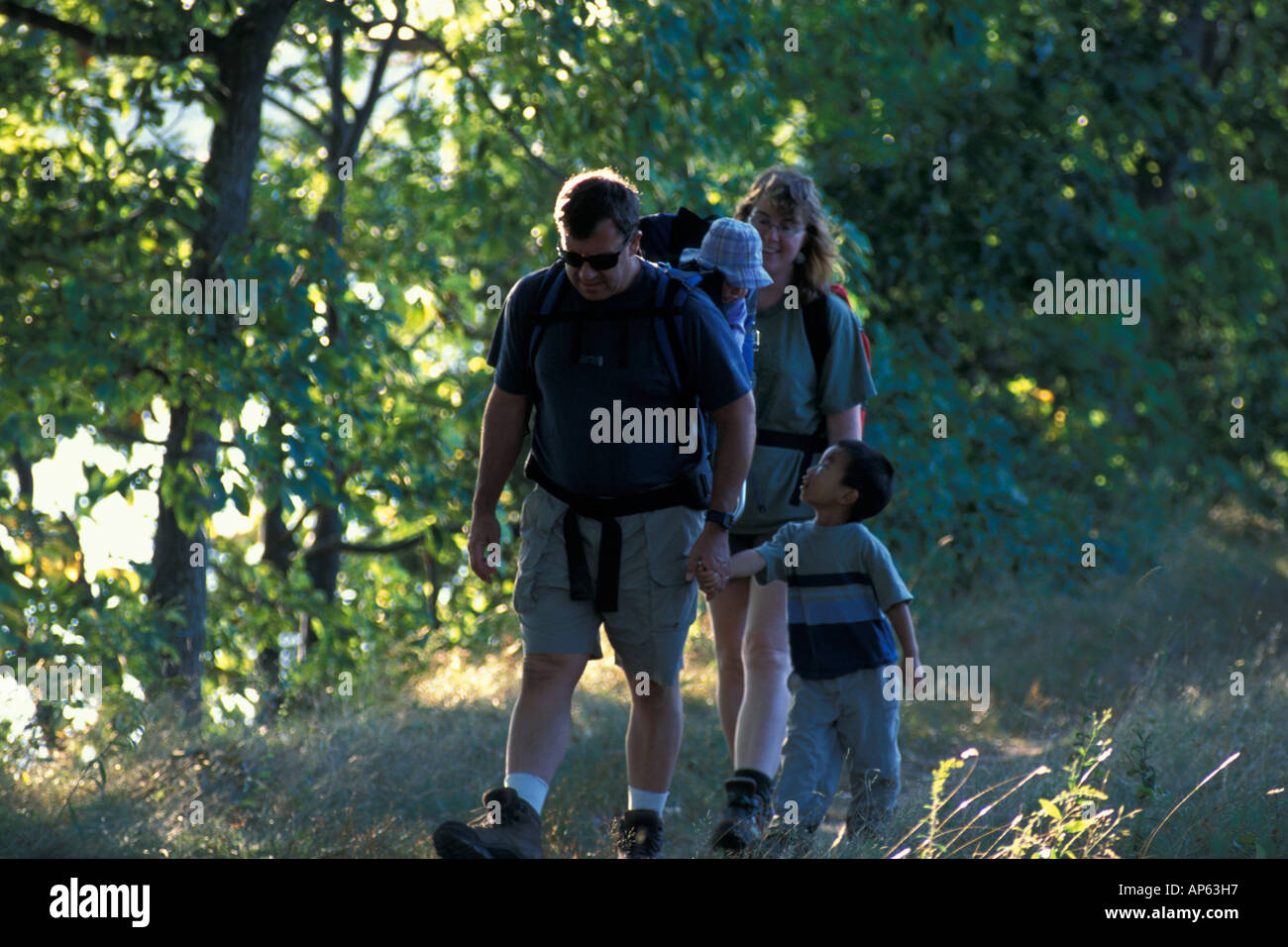 Durham, NH. A family enjoys the trails at Adams Point, a NH state ...