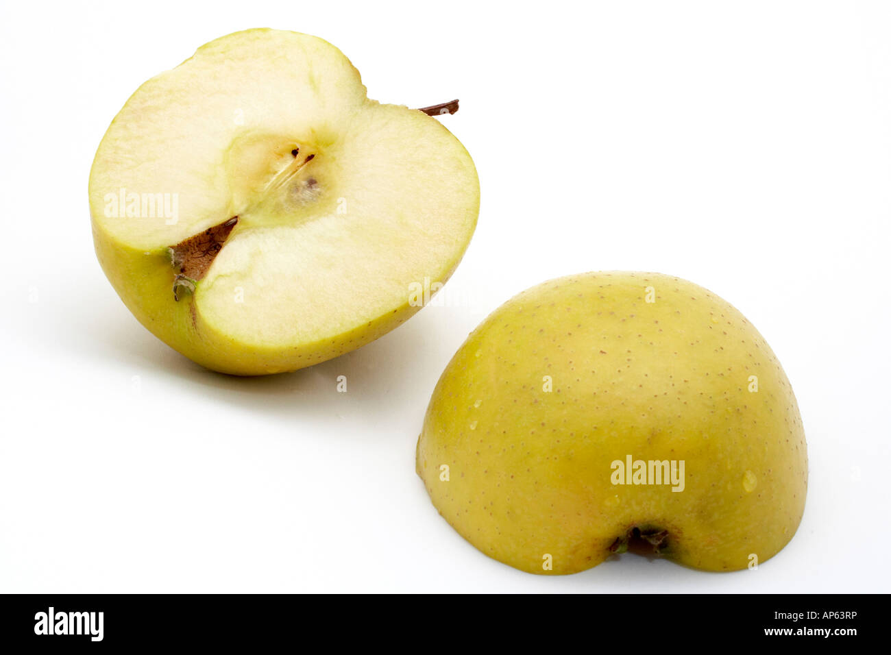 Two half apples on white background Stock Photo - Alamy