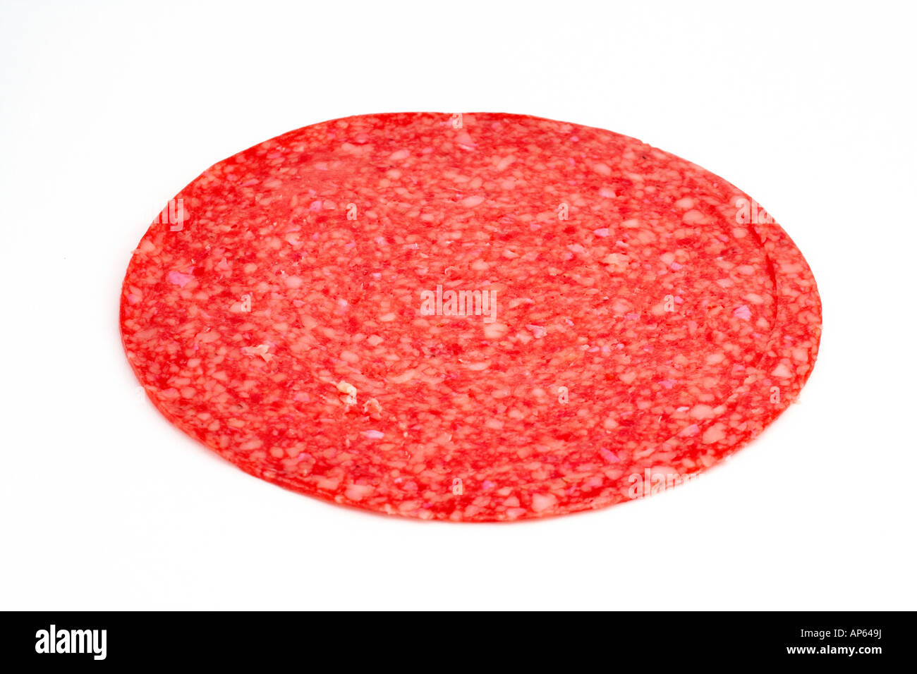 Salami slice closeup isolated on white background Stock Photo - Alamy