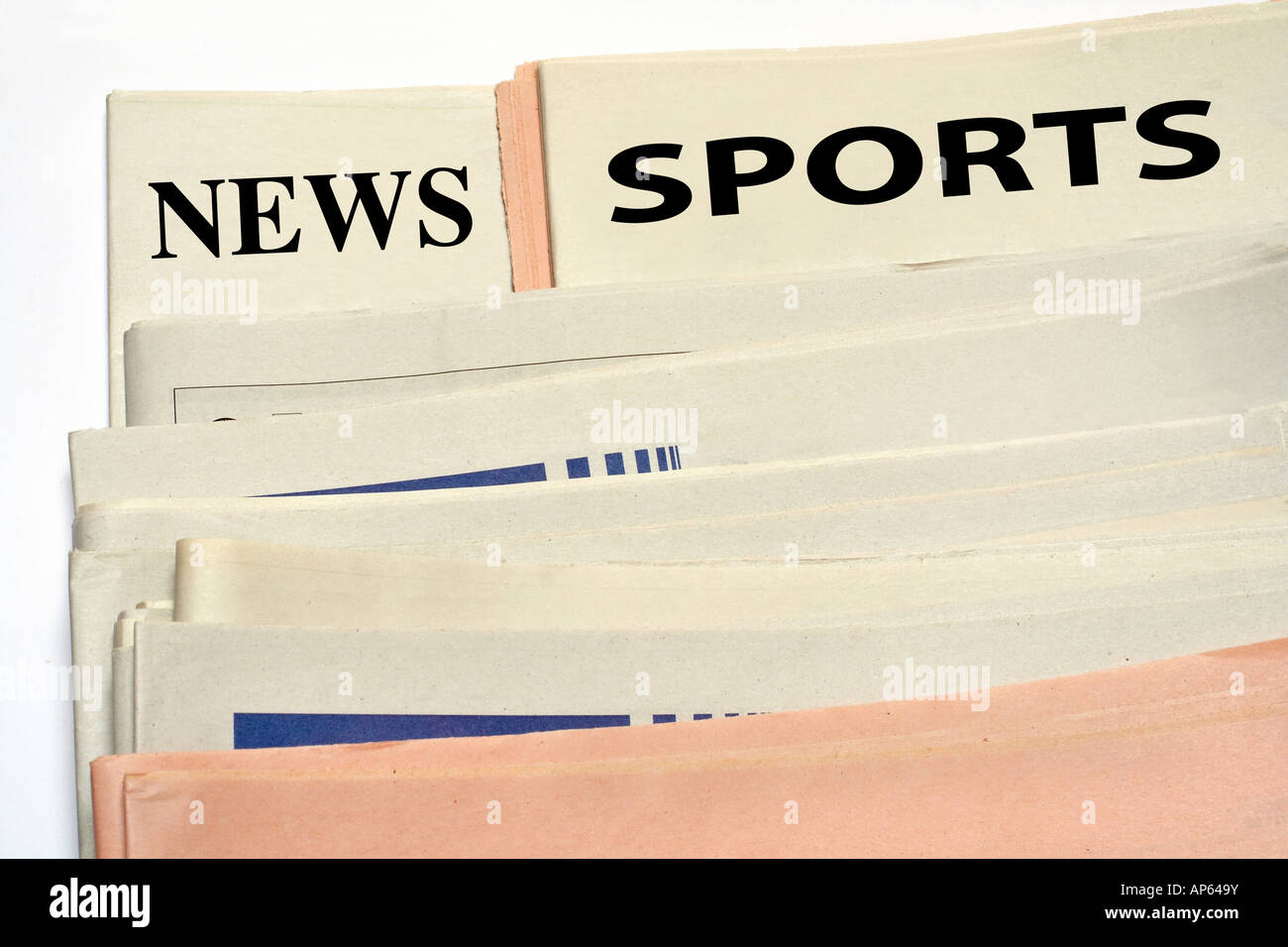 Stacked sports newspapers on white background Stock Photo - Alamy