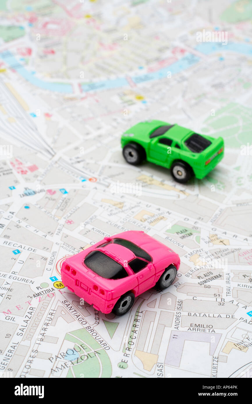 Two cars on the travel map Stock Photo - Alamy