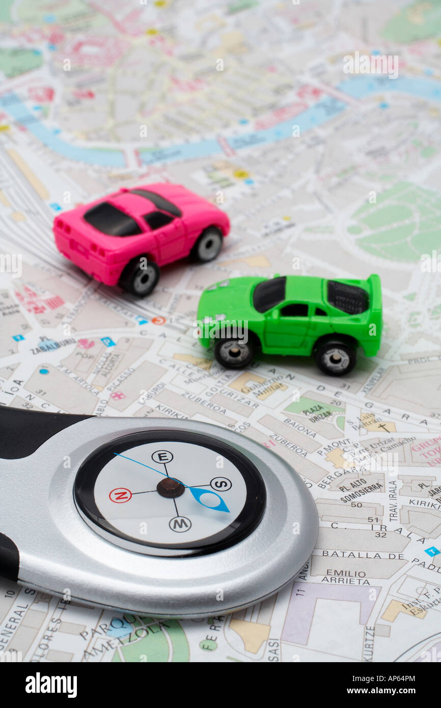 Compass and two cars on the travel map Stock Photo - Alamy