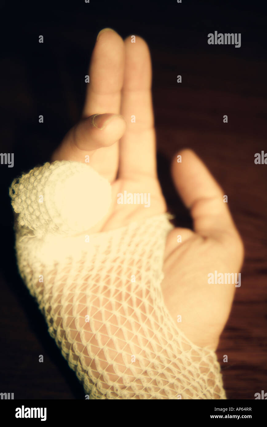 Wounded hand bandaged Stock Photo - Alamy