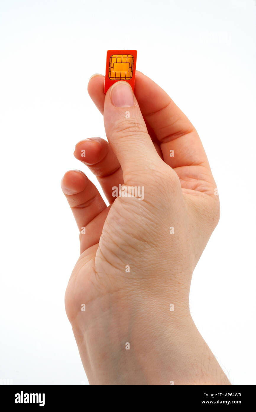 Fingers holding a mobile phone GSM SIM Card Isolated on white ...