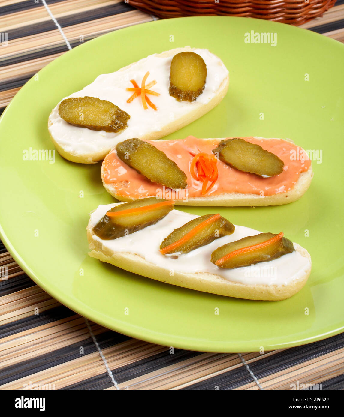 Three canapes on a green porcelain plate Stock Photo - Alamy