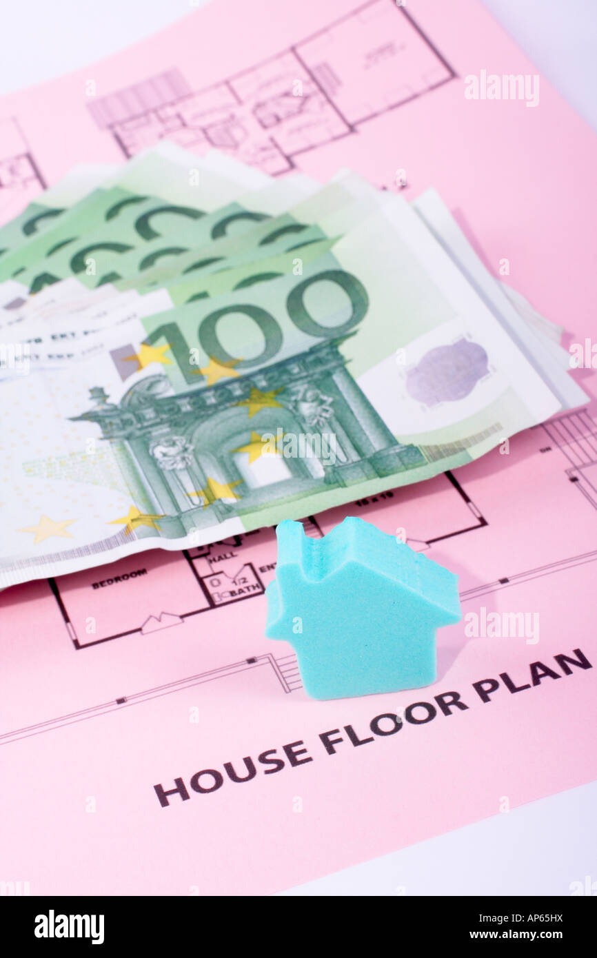 House and money on home plan background Stock Photo - Alamy