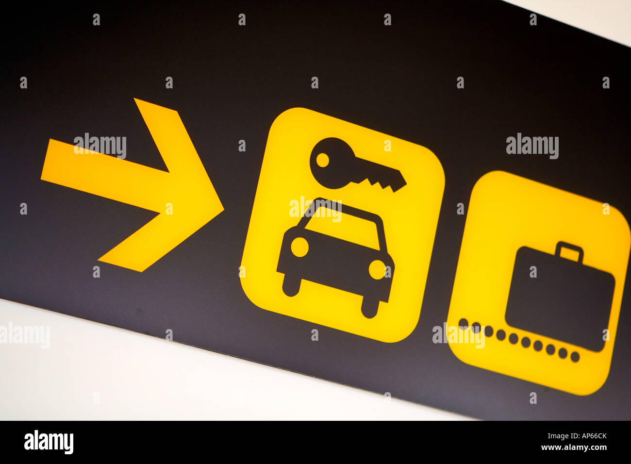 Follow the yellow sign at airport Stock Photo - Alamy