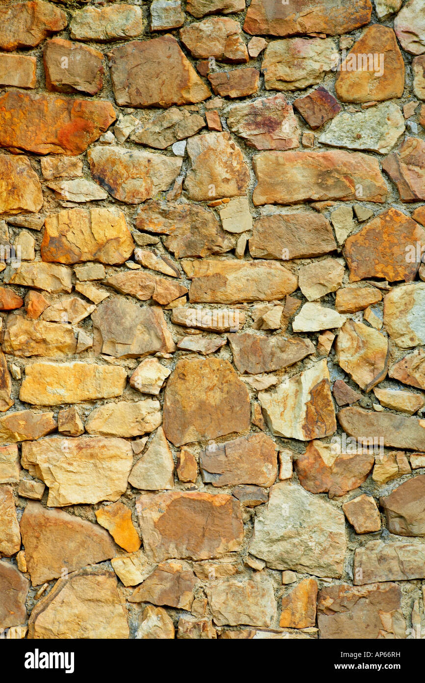 A old wall of hard stones Vertical background Stock Photo - Alamy