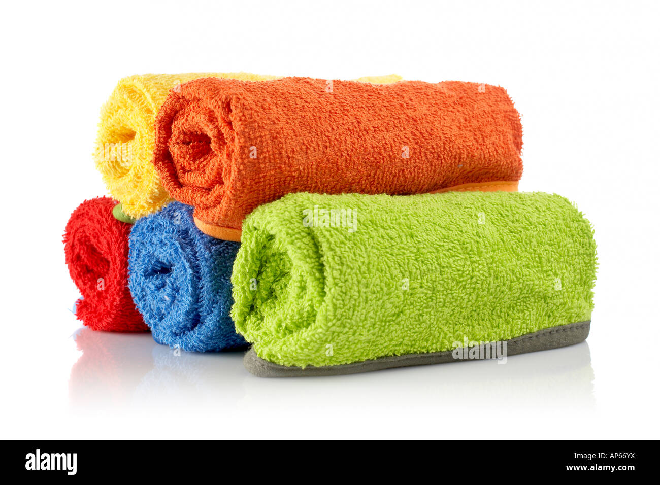 Multicolour towels rolls reflected on white background Stock Photo - Alamy