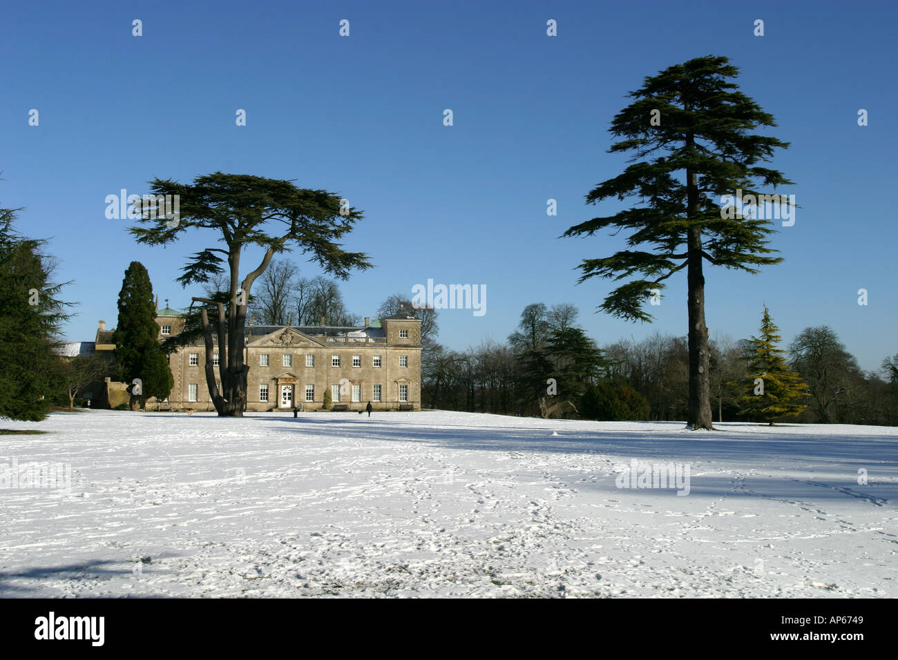 The mansion house and surrounding park of Lydiard Tregoze in the snow ...