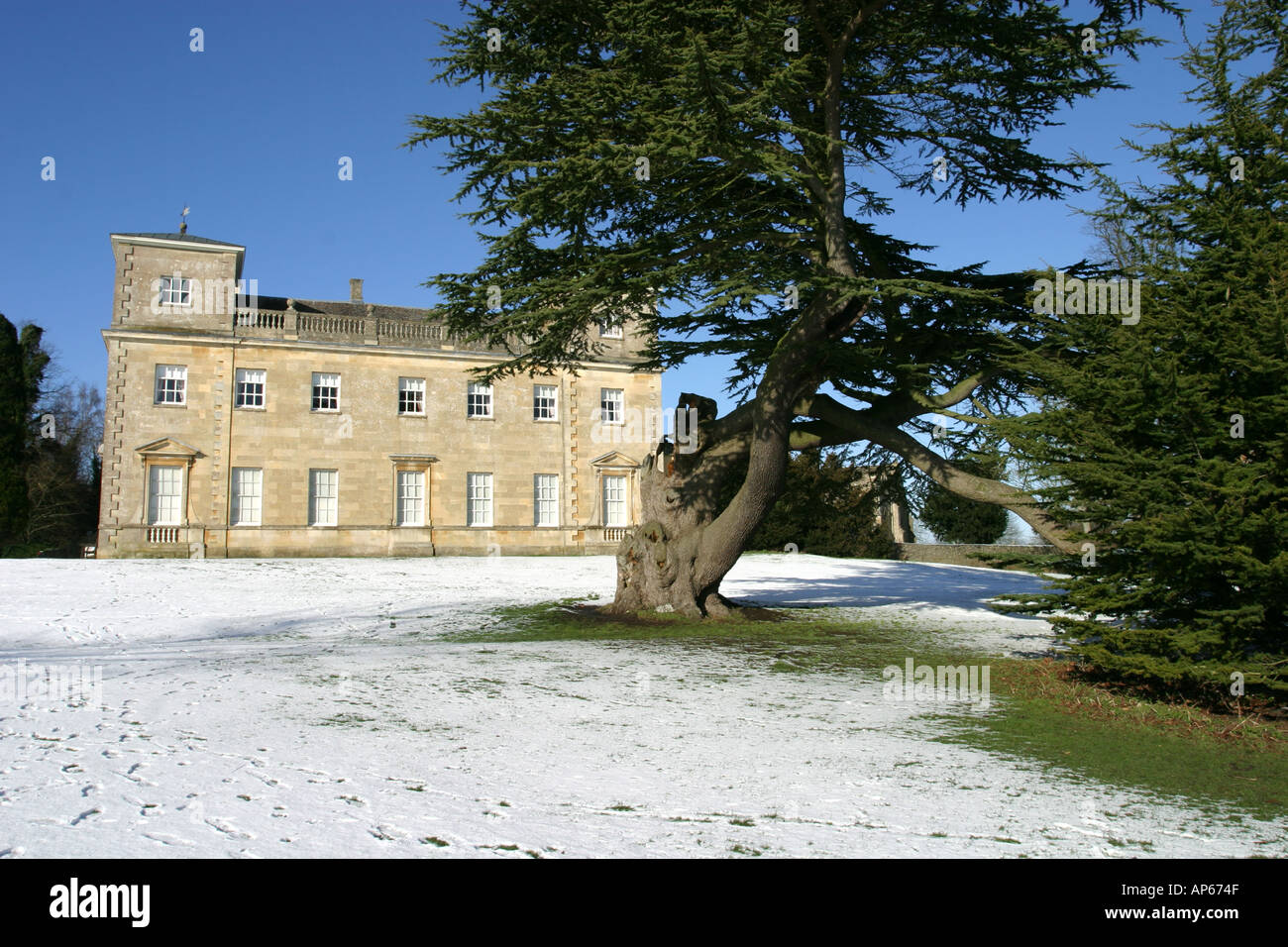 The mansion house and surrounding park of Lydiard Tregoze in the snow ...