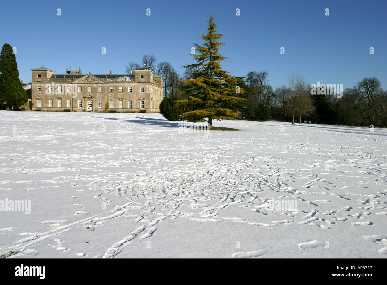 The mansion house and surrounding park of Lydiard Tregoze in the snow ...