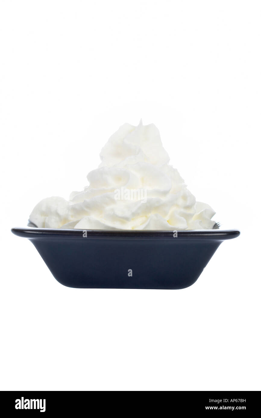 Fresh cream in a black dish isolated on white background Stock Photo ...