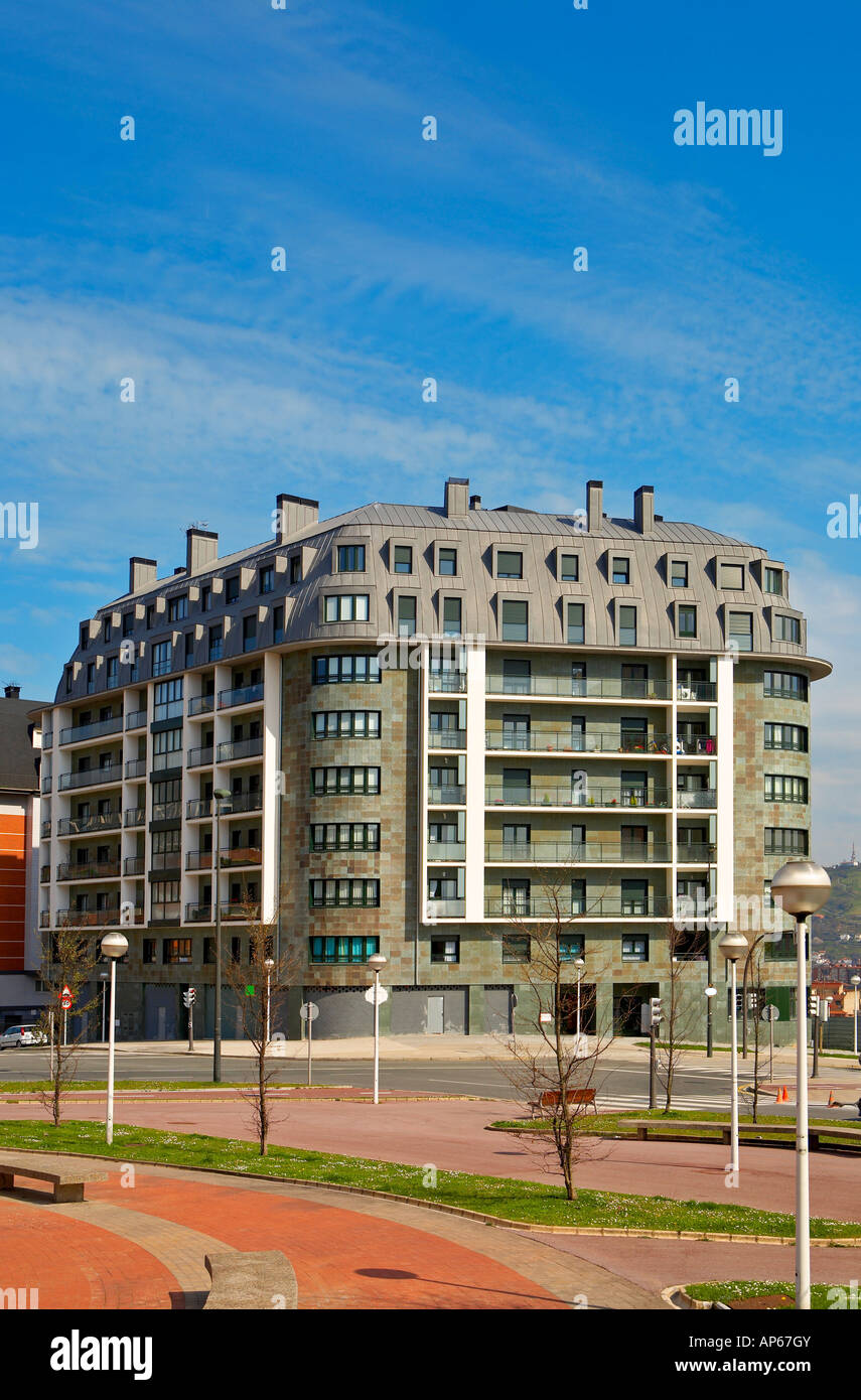 A built modern apartments block over a blue sky Stock Photo - Alamy
