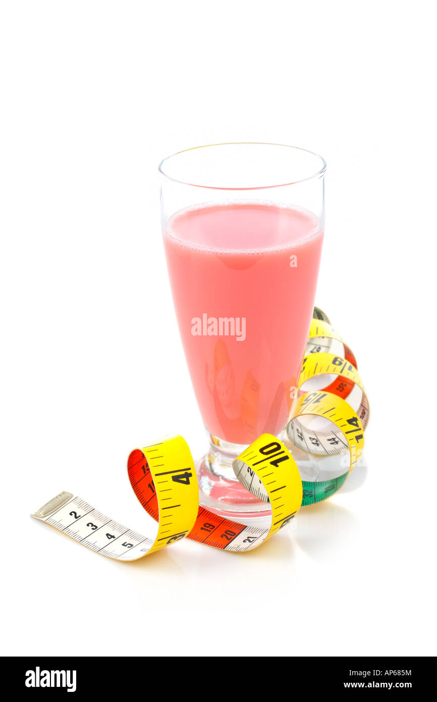 A fresh and nutritious diet strawberry milkshake with a measuring tape ...