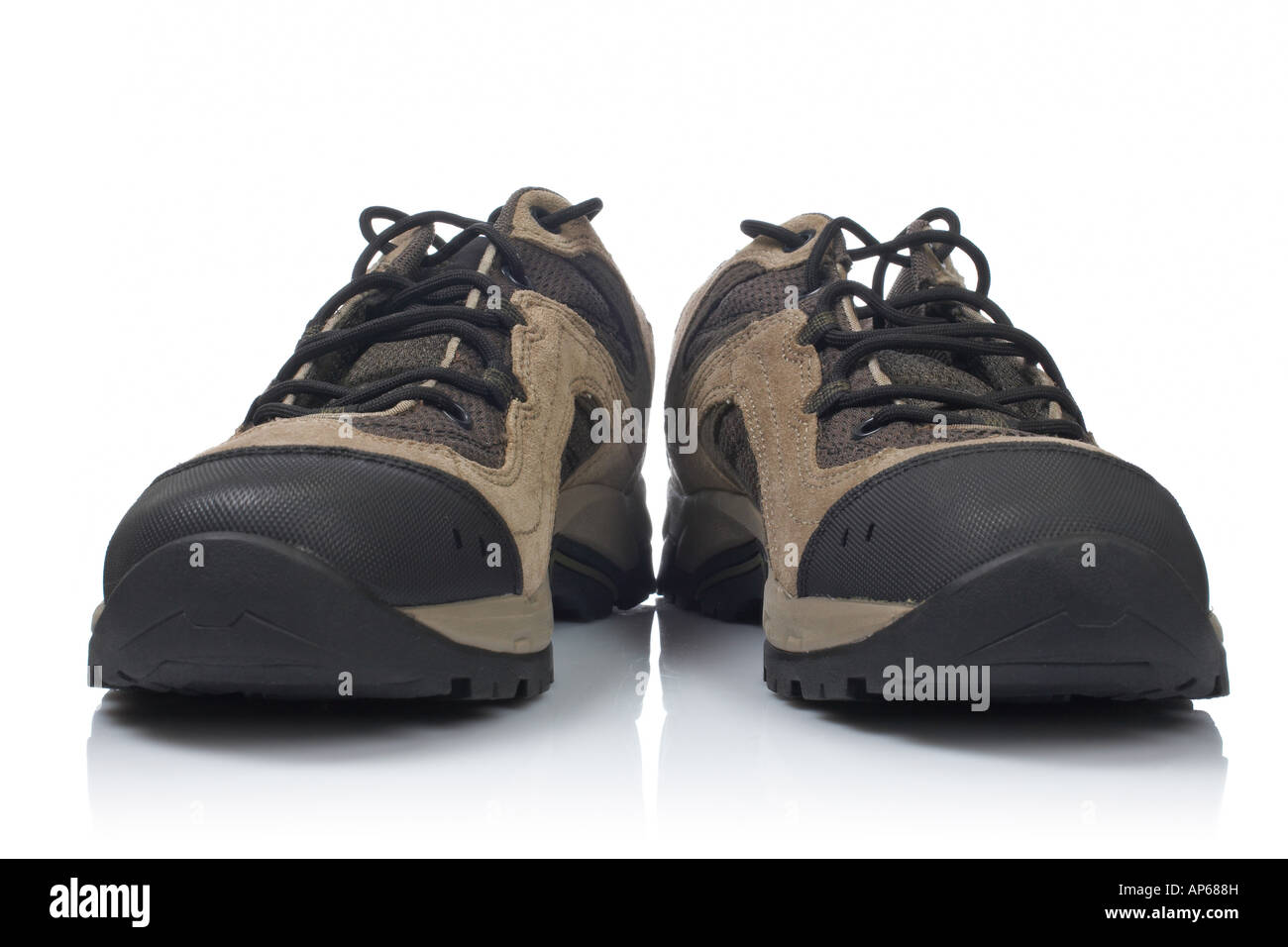 A pair of hiking boots with shadow reflected on white background Stock ...