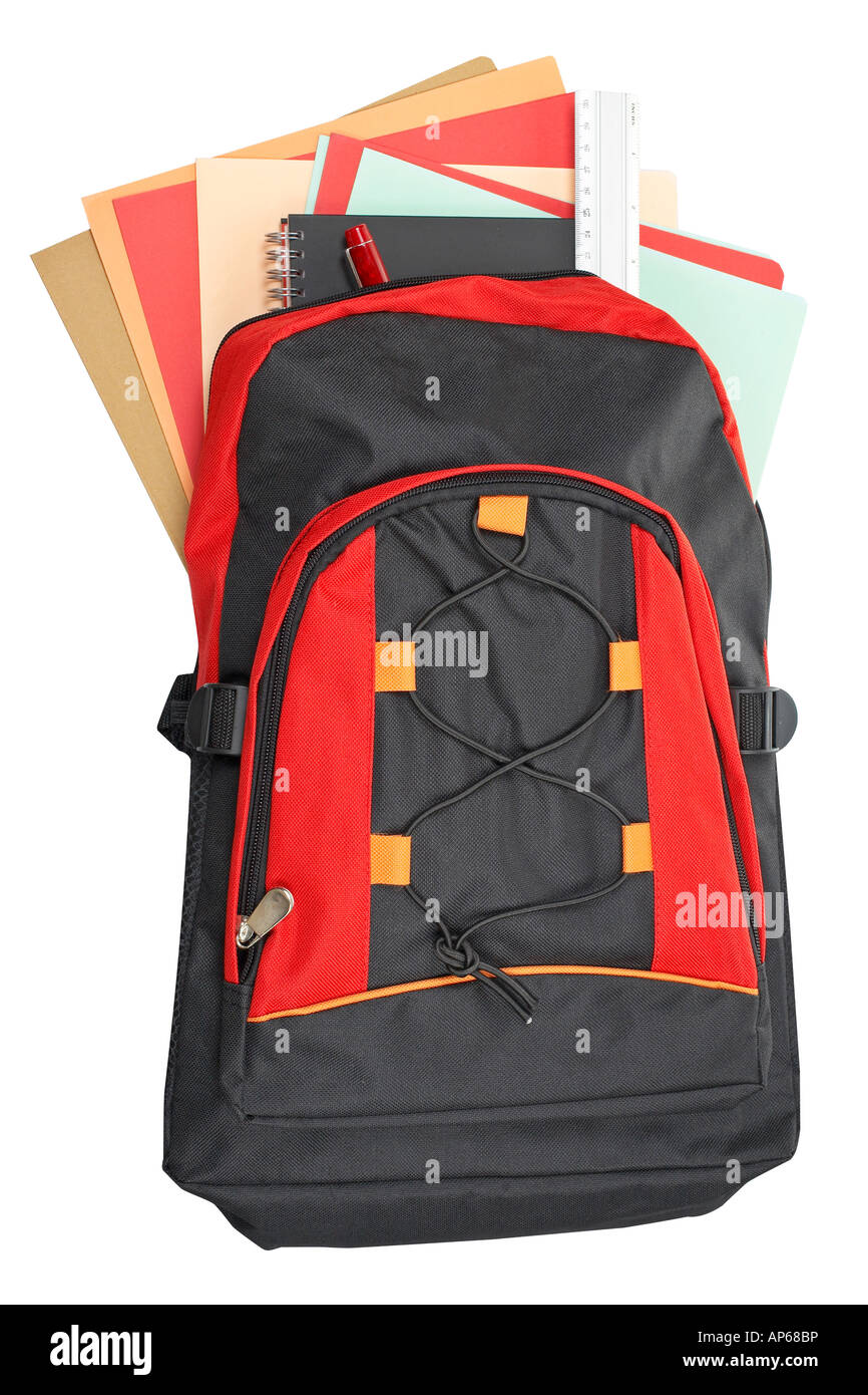 A black and red backpack with school material over a white background ...