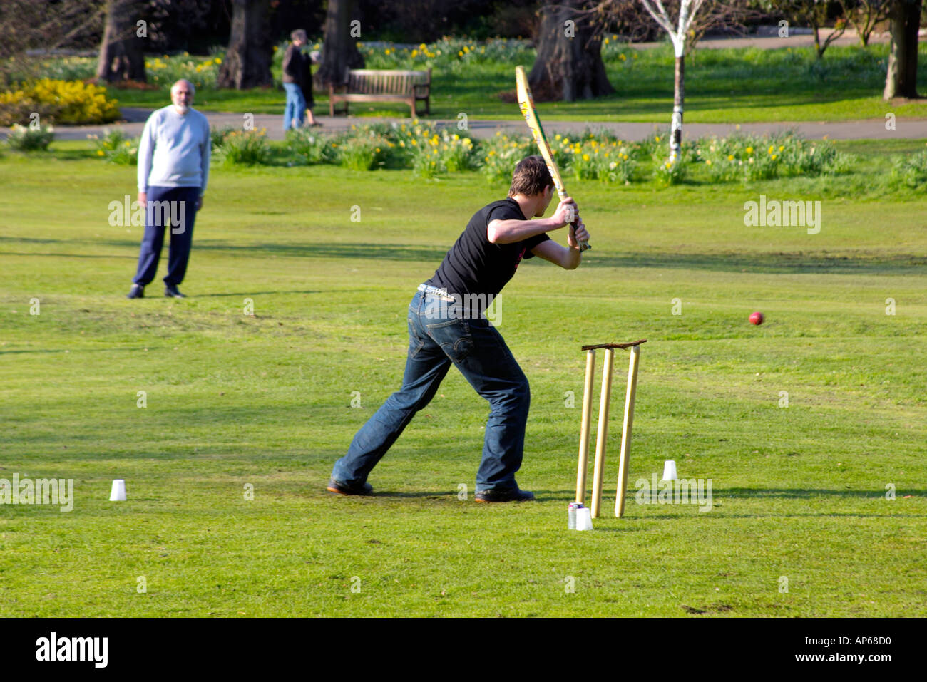 Man playing cricket in park in London England Britain UK Stock Photo ...