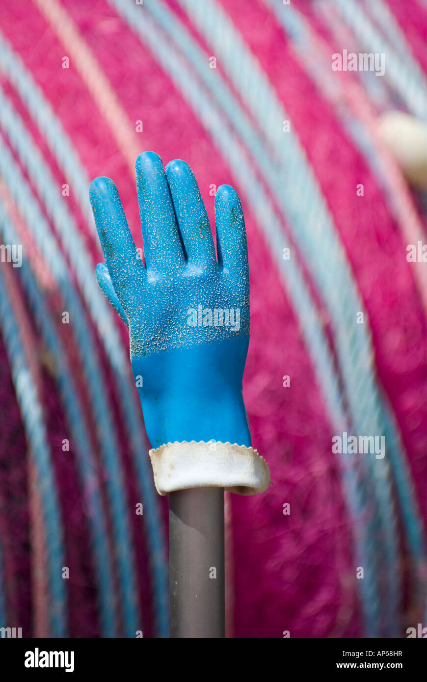 Helping Hand - a glove placed upright on a post, appearance of offering ...