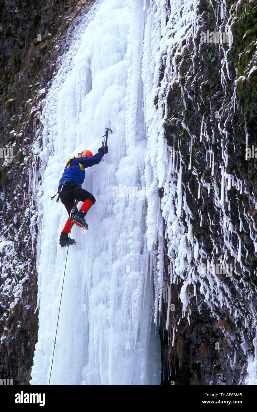 A man lead climbing up a frozen waterfall in the Columbia River Gorge ...