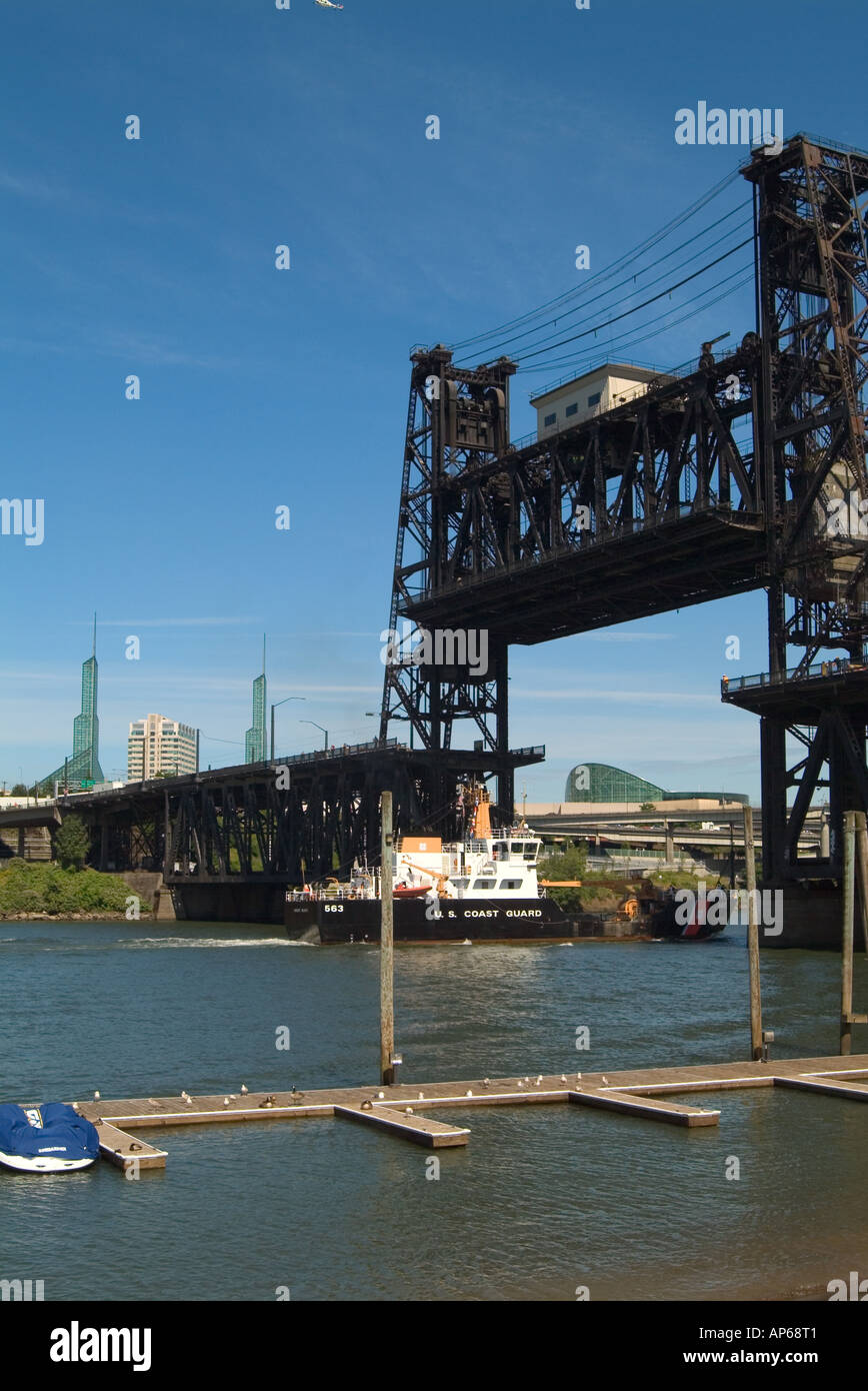 USA, Oregon, Portland, Coast Guard vessel going under the center span ...