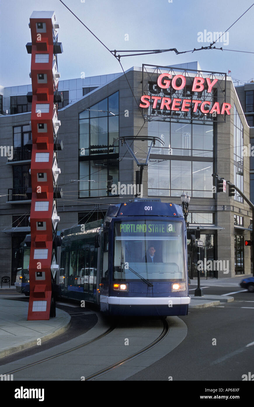 USA, Oregon, Portland, streetcar turning past one of the many ...