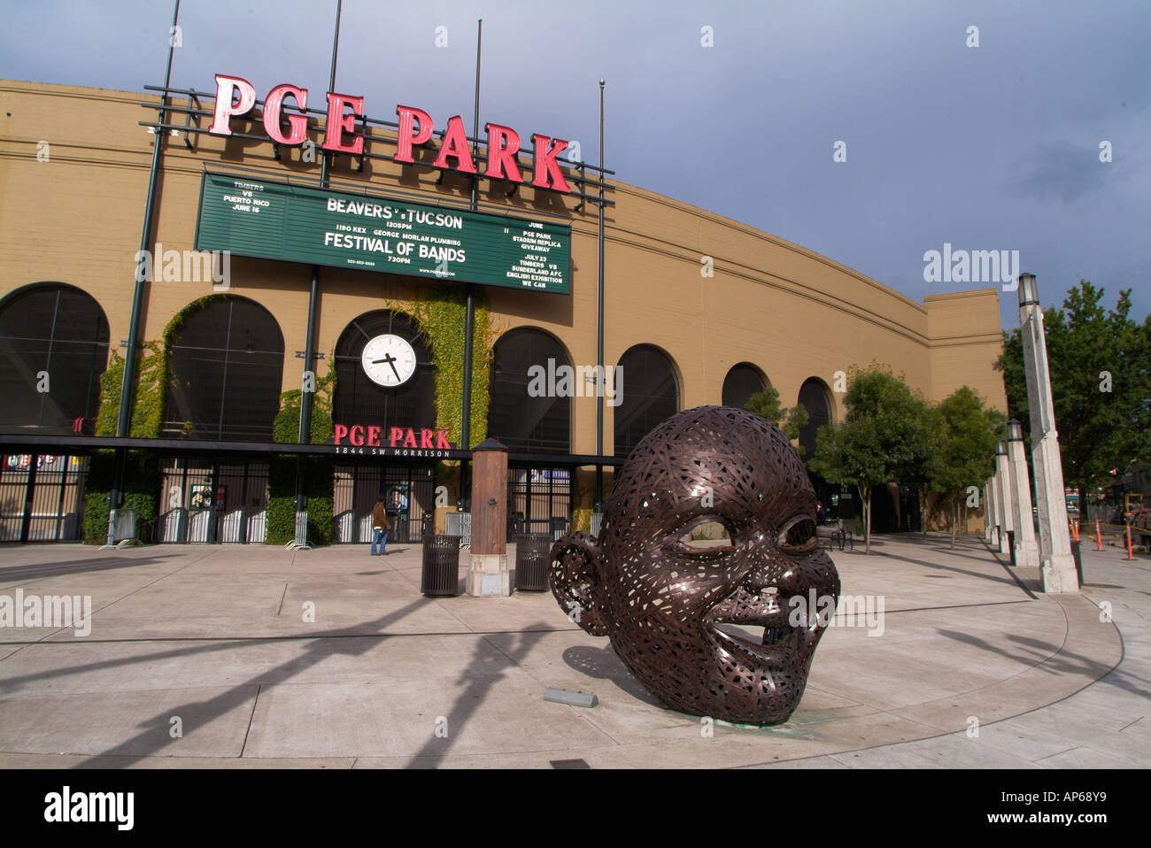 USA, Oregon, Portland, Bronze face smiling in front of PGE Park, home ...