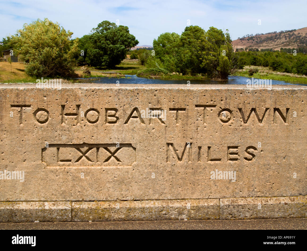 Heritage mile sign to Hobart on historic bridge in Ross Stock Photo - Alamy