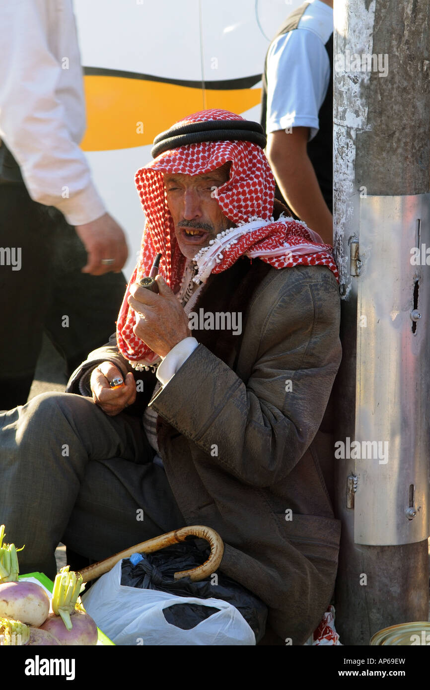 An Arab man smokes a pipe in the eastern part of Jerusalem Stock Photo ...