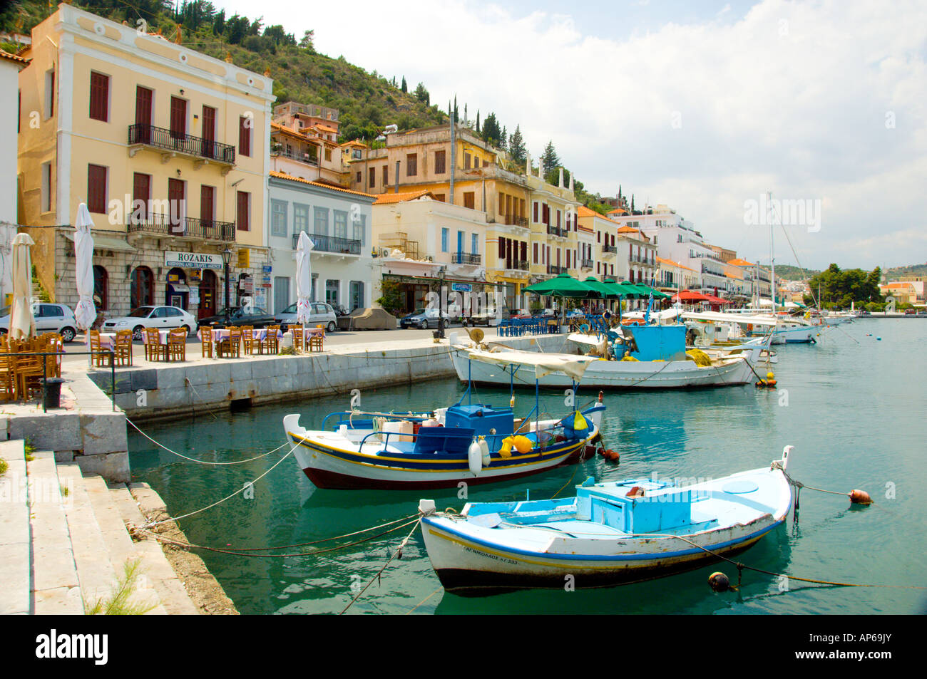 Pastel colored buildings on the waterfront and colorful fishing boats ...