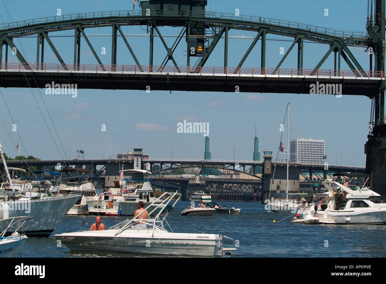 USA, Oregon, Portland, Boats on the Willamette River, with the ...