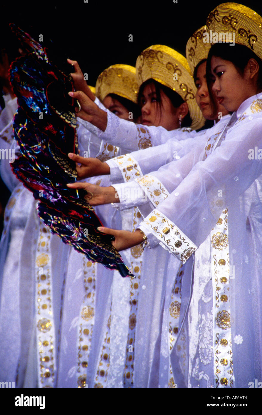 USA, Oregon, Portland, Hmong Dancers performing traditional dance with ...