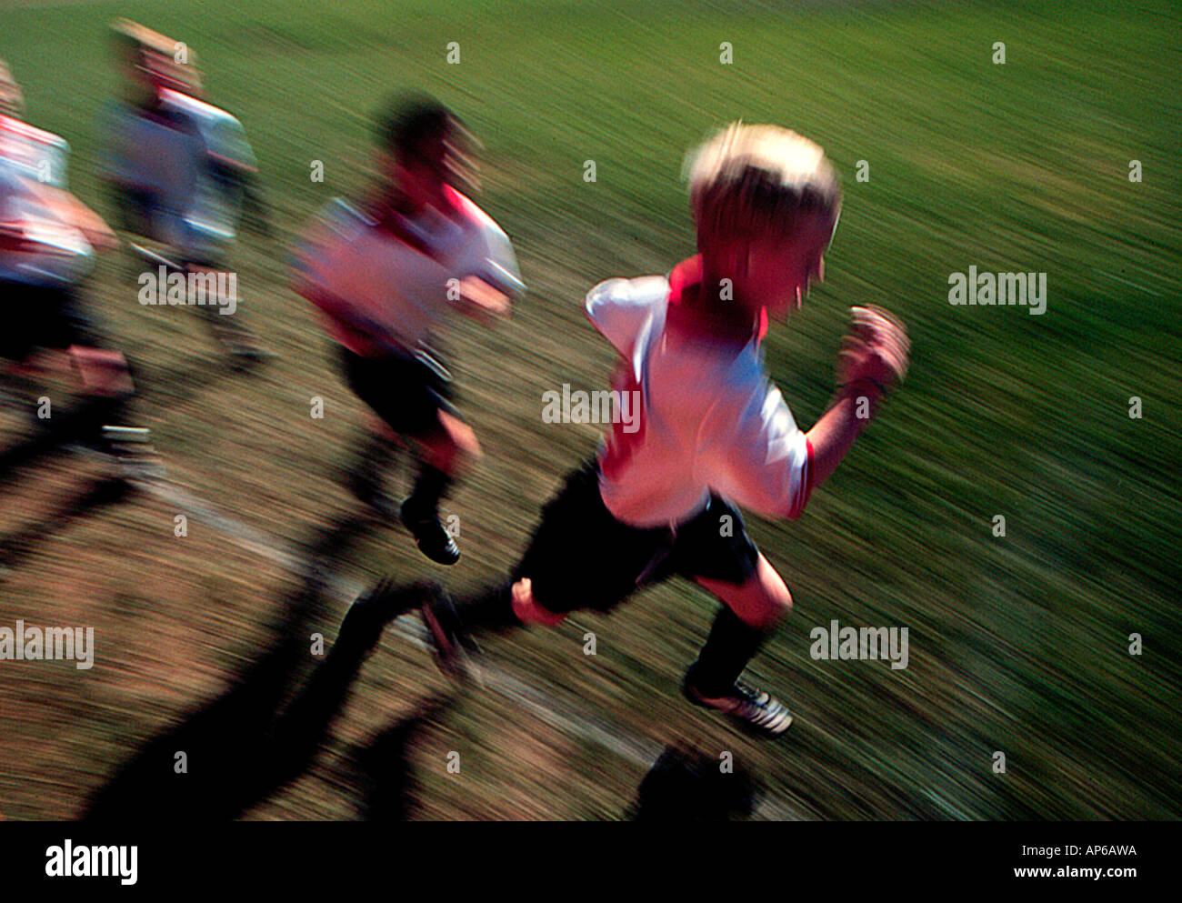 Elementary school children running on the school grounds Stock Photo ...