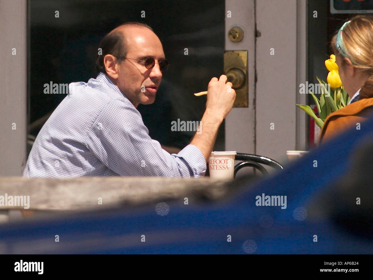 East Hampton NY 042003 Financier Sam Waksal grabs a bite to eat with an ...