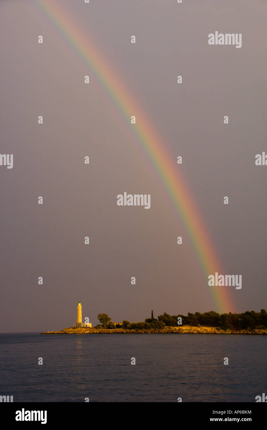 A rainbow with lighthouse at the fishing town of Githeo Greece Stock ...