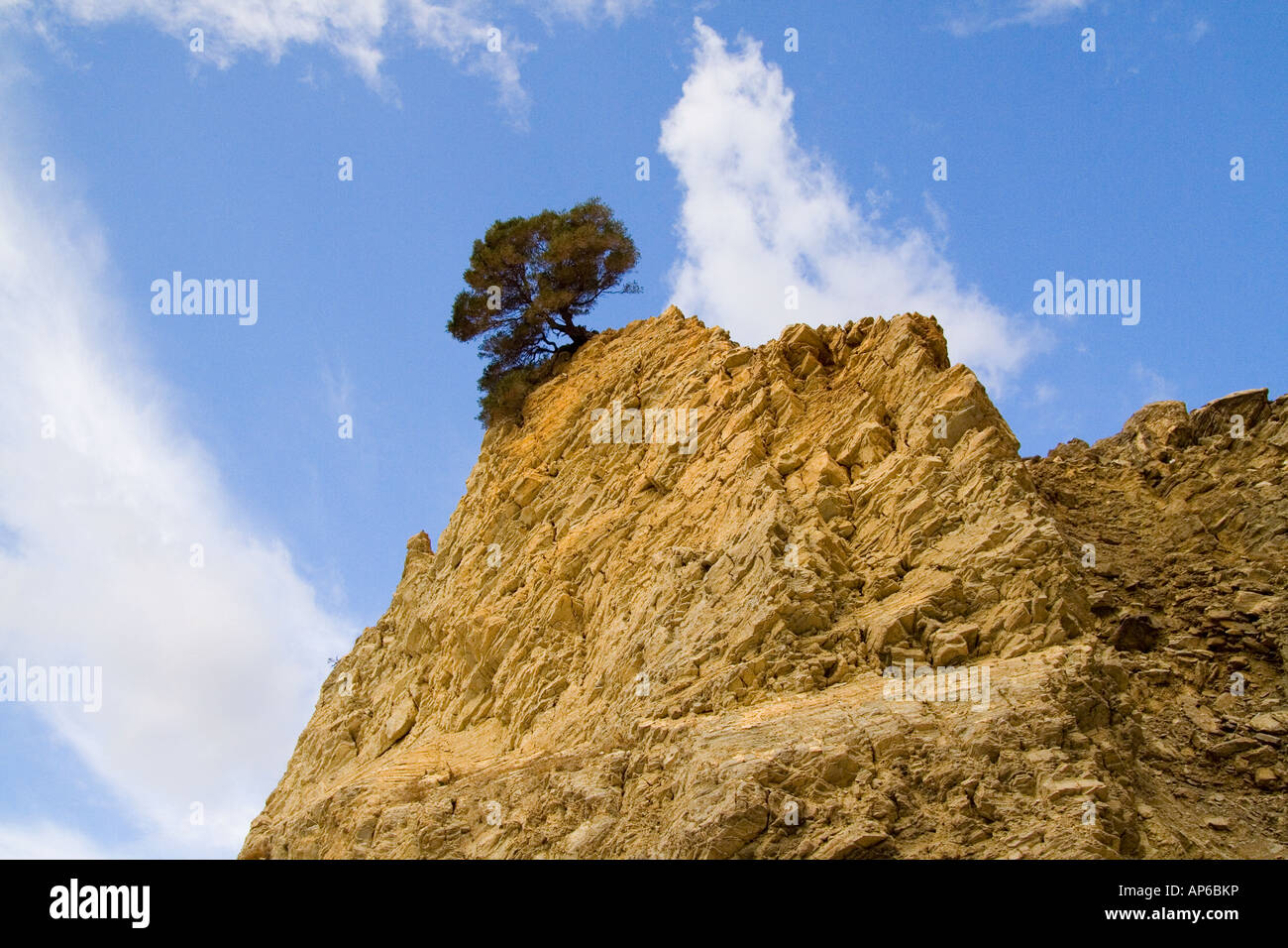 Rocky out crop, Landscape, cliff side, tree top, clouds, perched on top ...