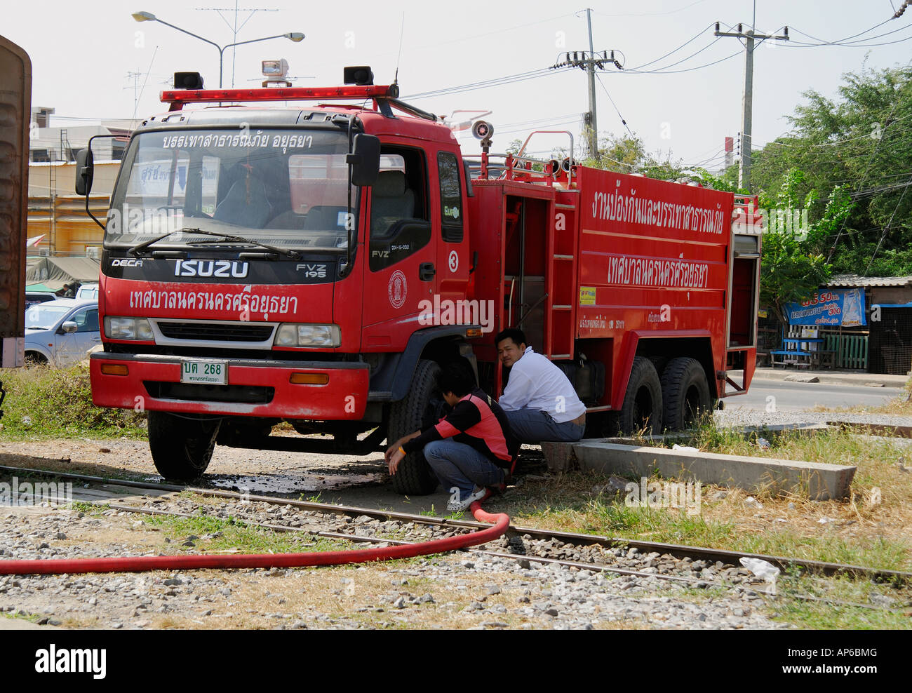 Fire engine fuelling steam locomotive at Ayutthaya,Thailand Stock Photo ...