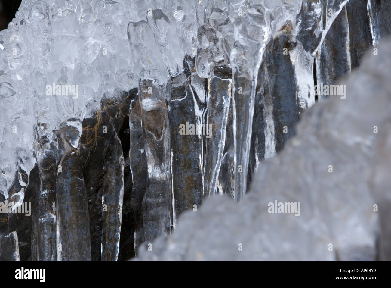 icicles formed by the freezing of dripping water Stock Photo - Alamy