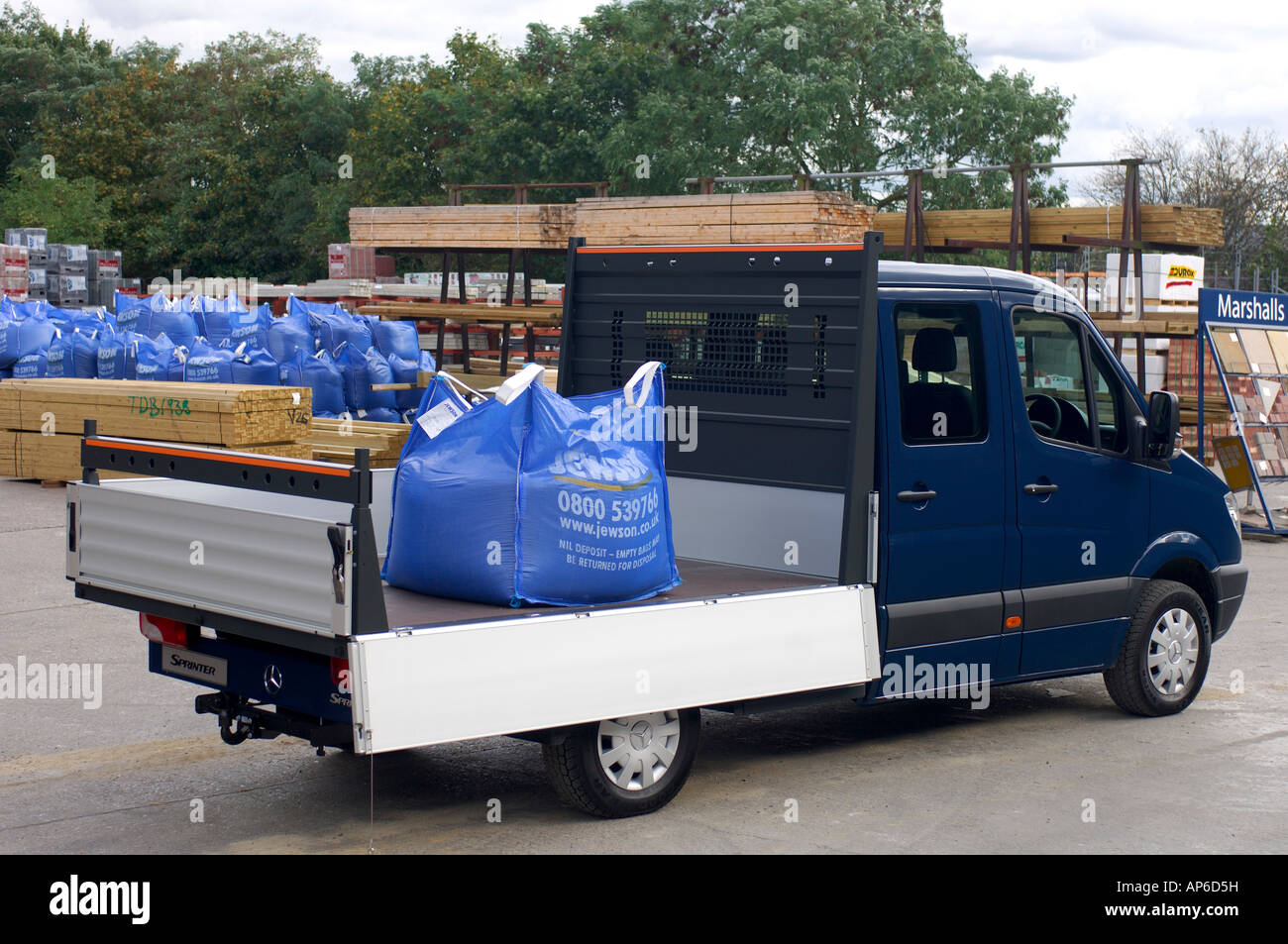 blue mercedes benz sprinter side loader van in builders merchants yard ...