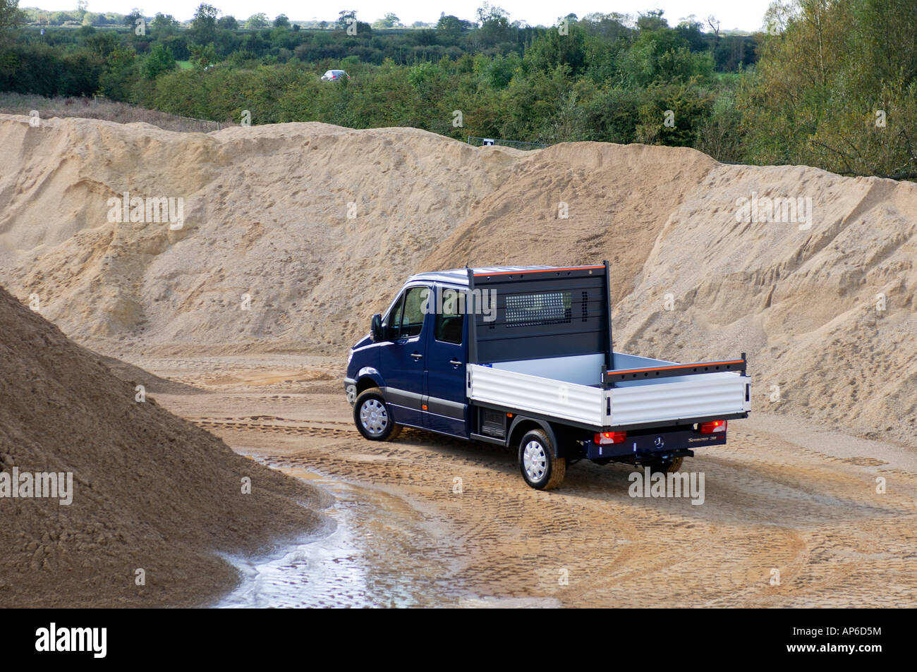 blue mercedes benz sprinter side loader van in sand quarry Stock Photo ...